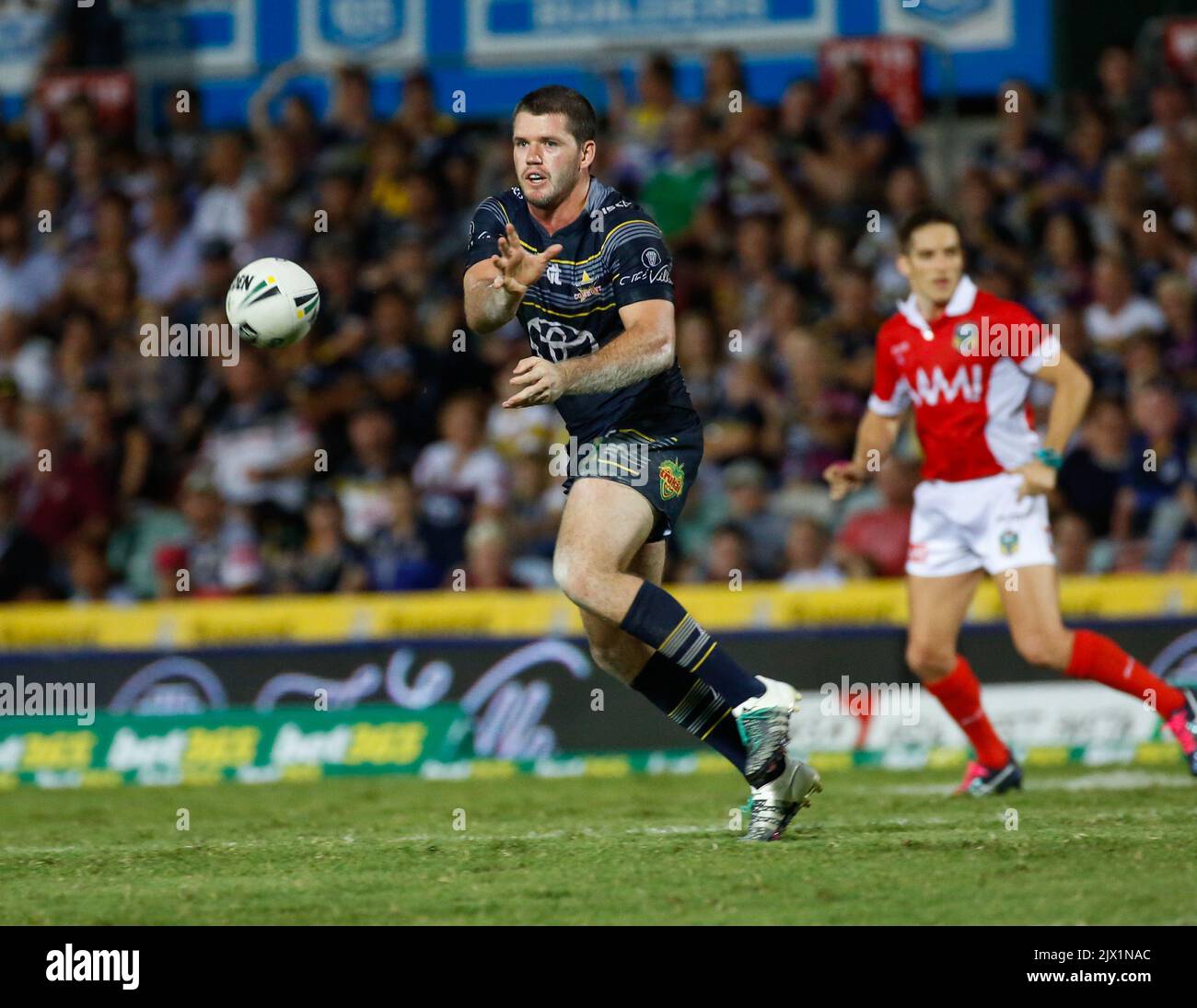 Cowboys Lachlan Coote gets a pass away during the round 8 NRL match ...