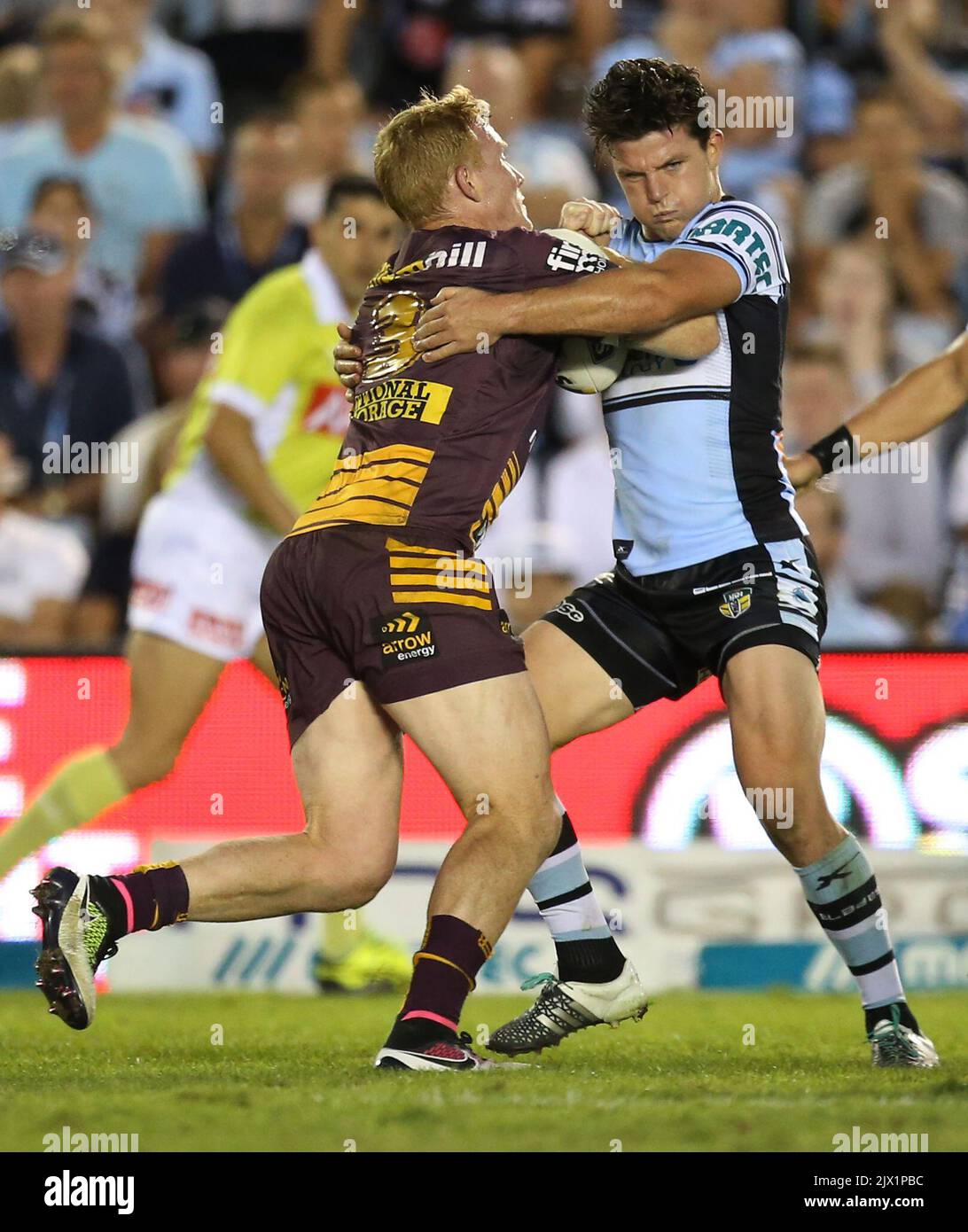 Chad Townsend of the Sharks tackles Jack Reed of the Brisbane Broncos ...