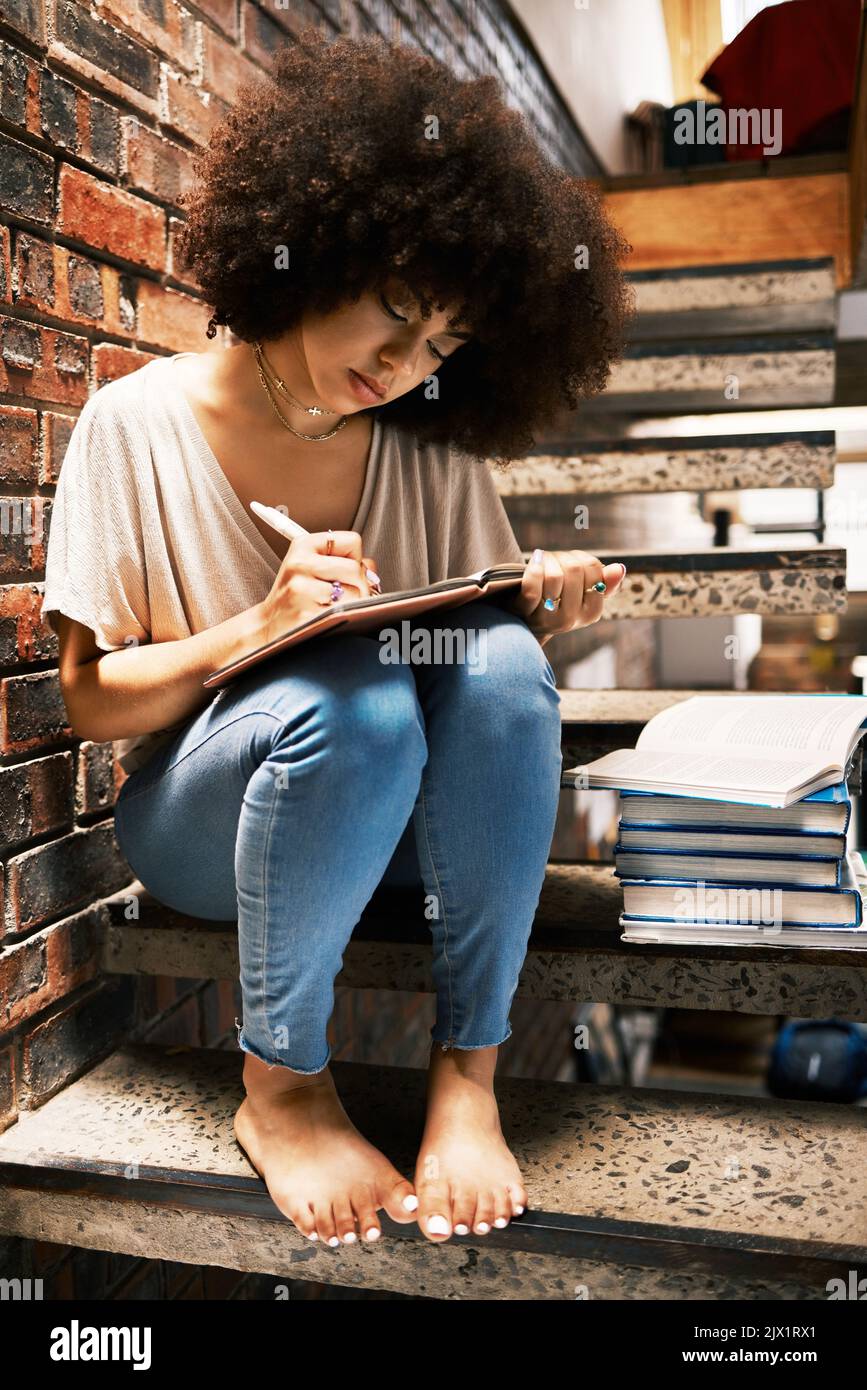 Learning, studying and black woman writing notes in a book, notebook or ...
