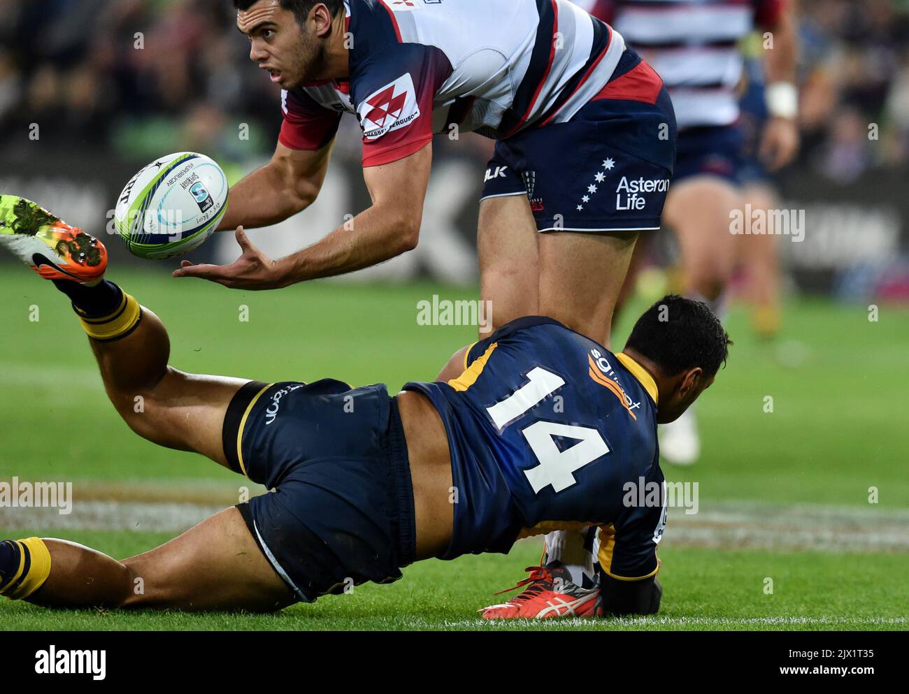 Nigel Ah Wong of the Brumbies tackles Jack Debreczeni of the Rebels ...