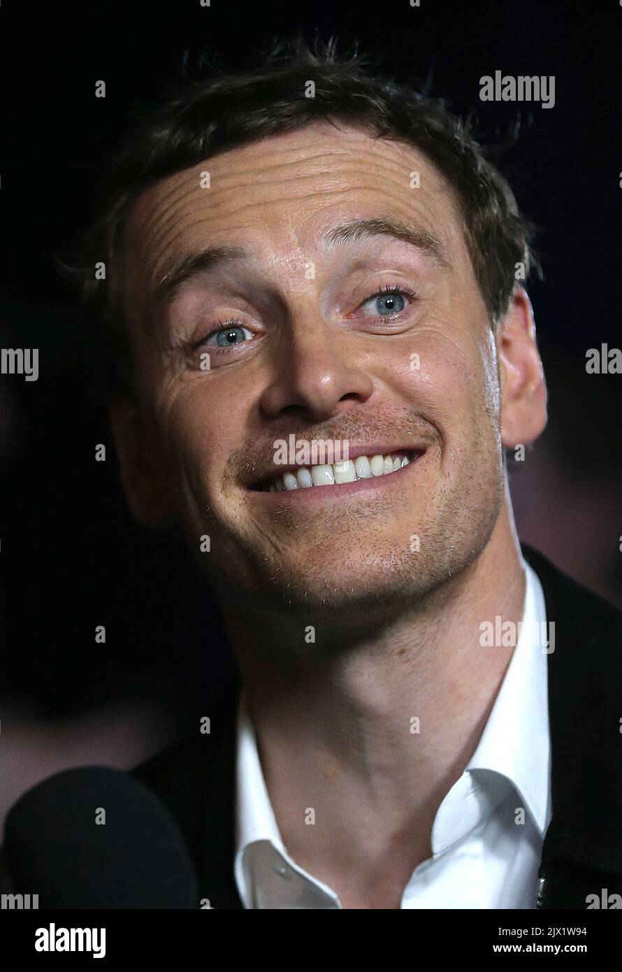 Actor Michael Fassbender, who plays the character Magneto, grins to ...