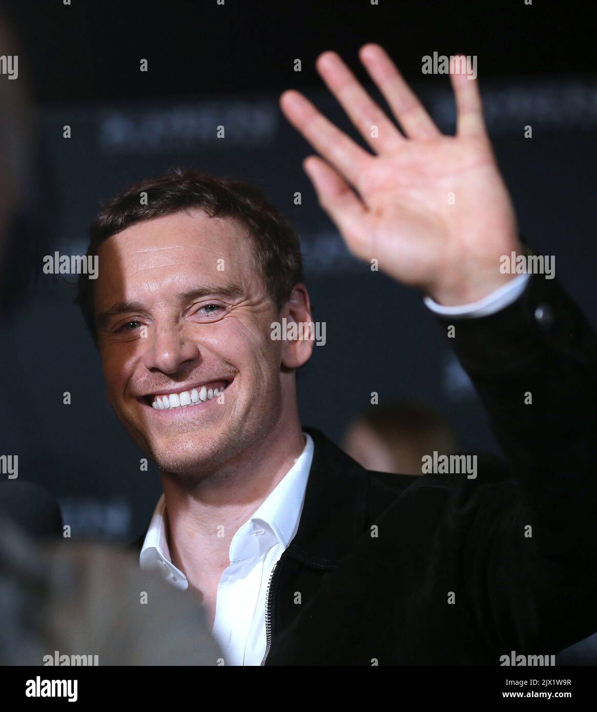 Actor Michael Fassbender, who plays the character Magneto, waves to ...
