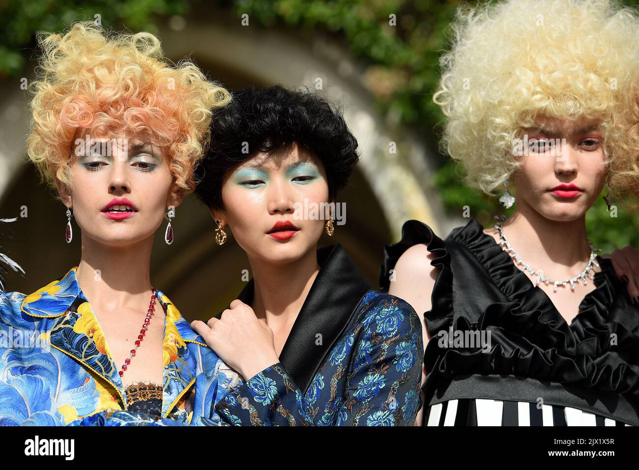 Models pose for a photograph after showing the creations of Australian ...