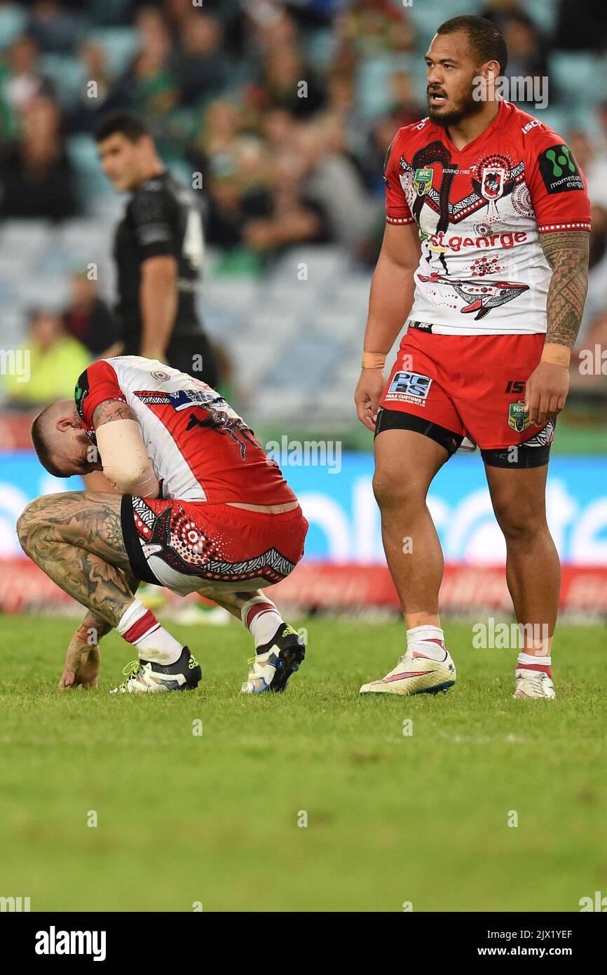Josh Dugan of the Dragons struggles after injuring his left arm during ...