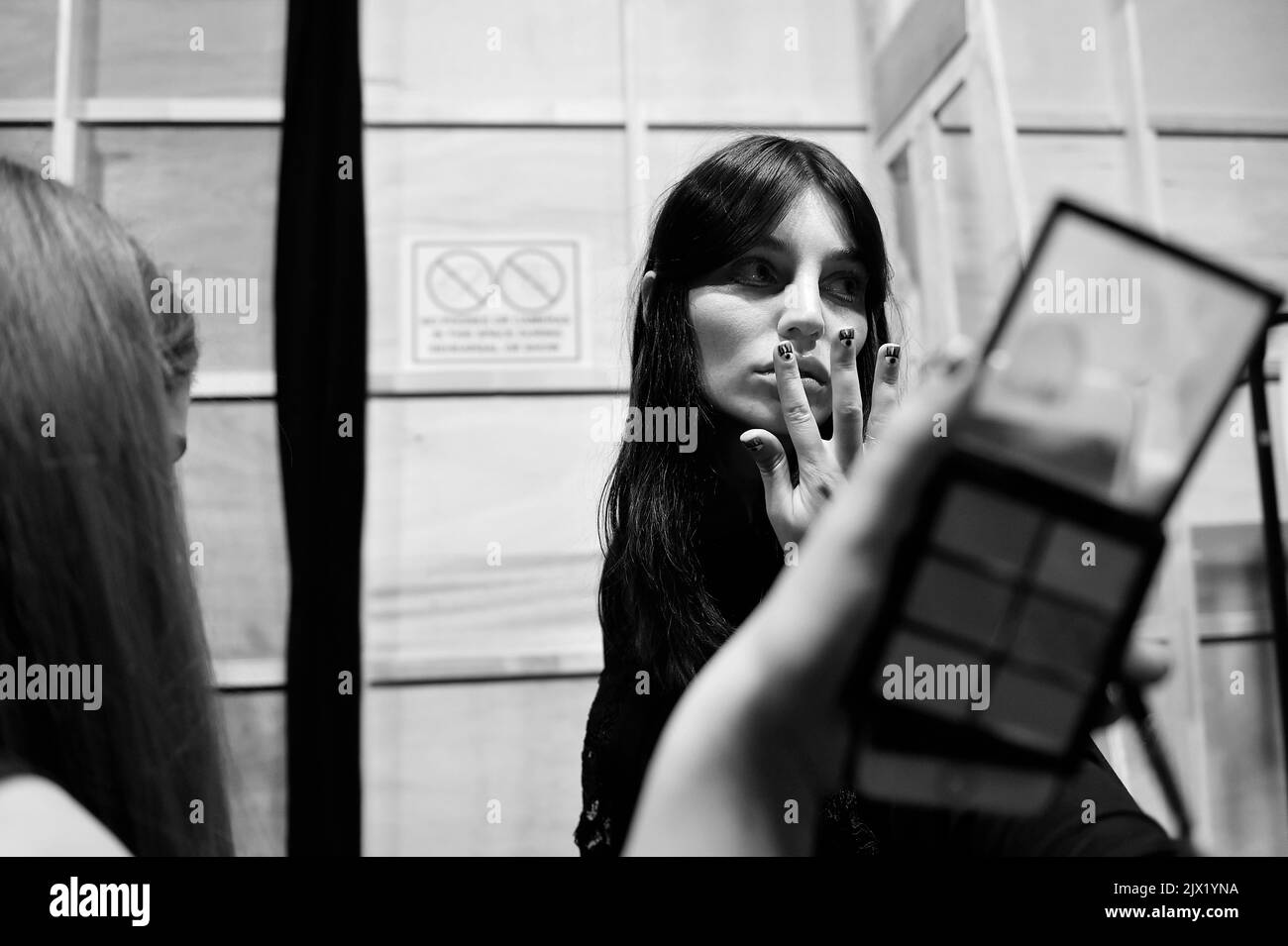 A model is seen backstage ahead of the Ginger and Smart show, during ...