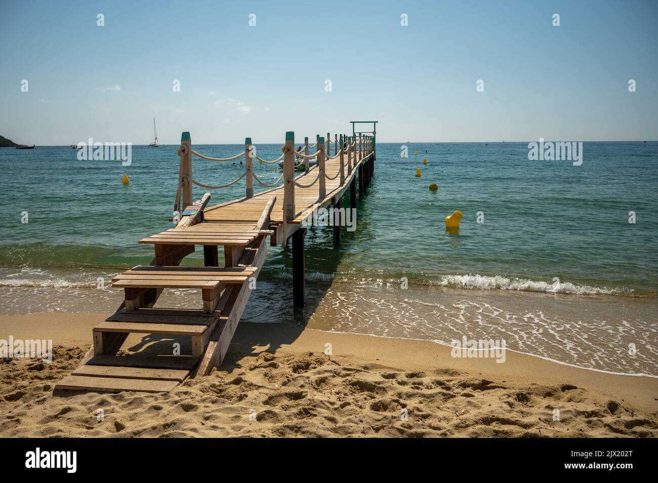 Wooden pier for guests of yachts on legendary Pampelonne beach near ...