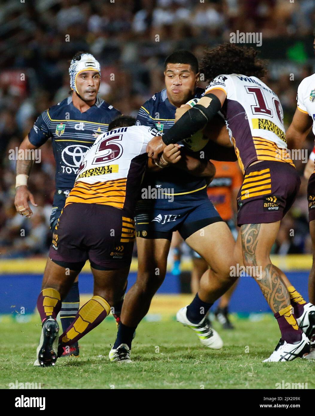 Cowboys John Asiata looks for a gap in the Broncos defence of Sam ...