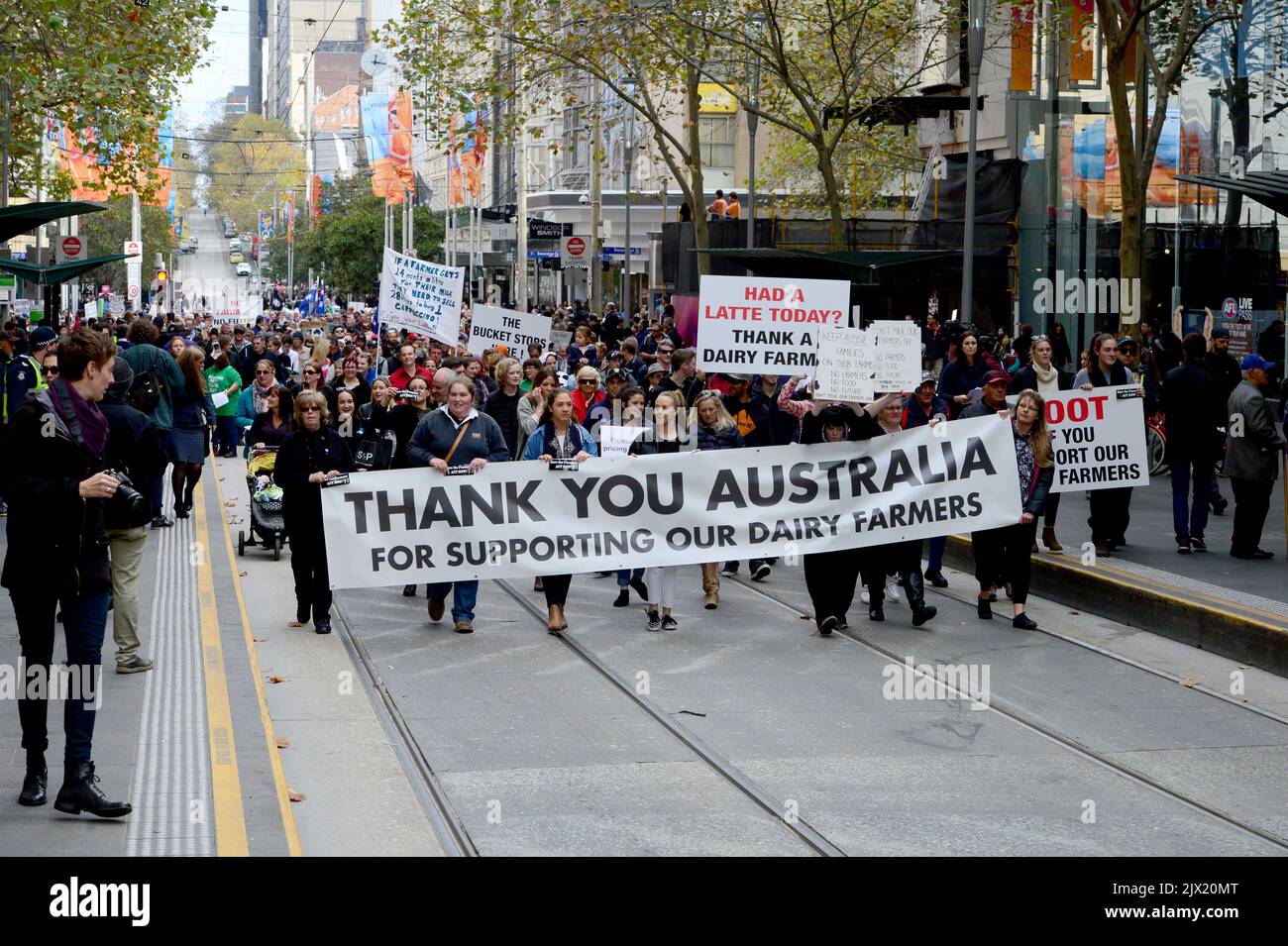 Dairy farmers march from Federation Square to Parliament House during a ...