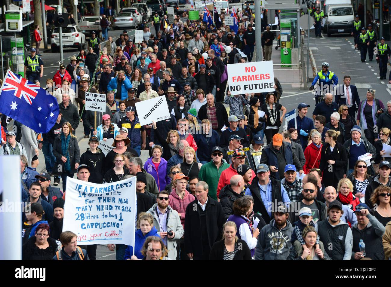 Dairy farmers march from Federation Square to Parliament House during a ...