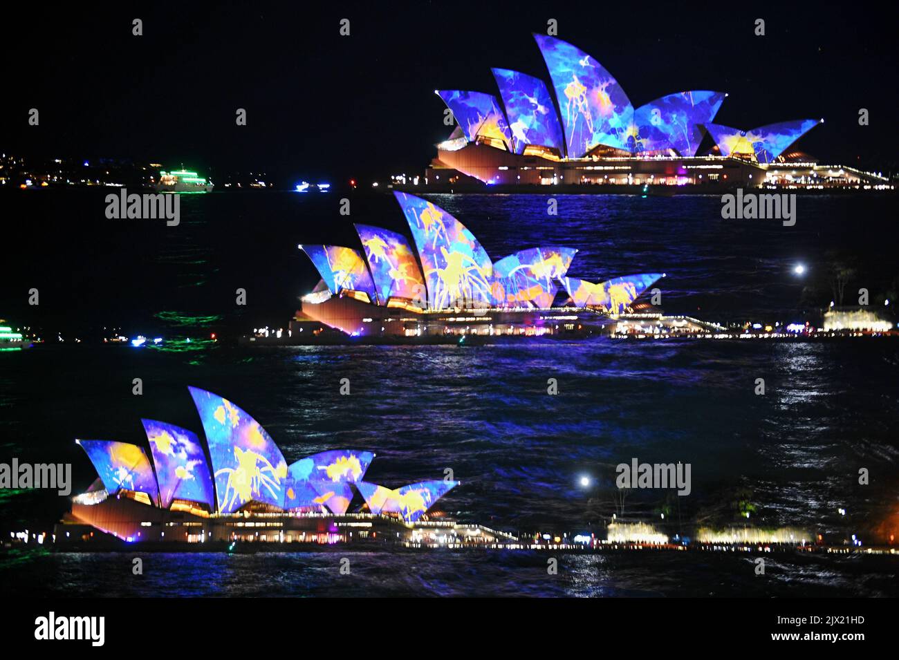 The sails on the Sydney Opera House are seen lit in a multiple exposure ...