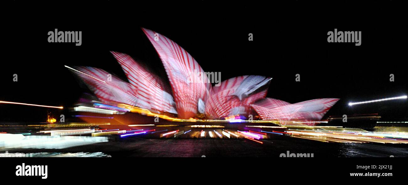 The sails on the Sydney Opera House are seen lit during a slow exposure ...