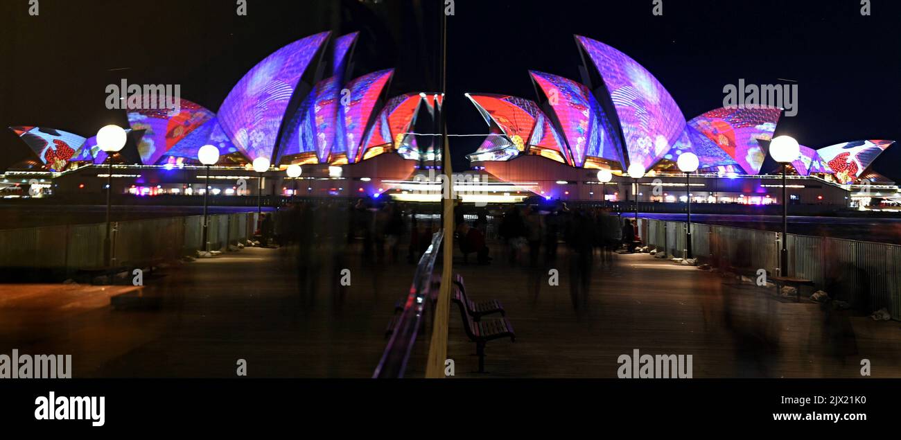 The sails on the Sydney Opera House are seen lit during a slow exposure ...