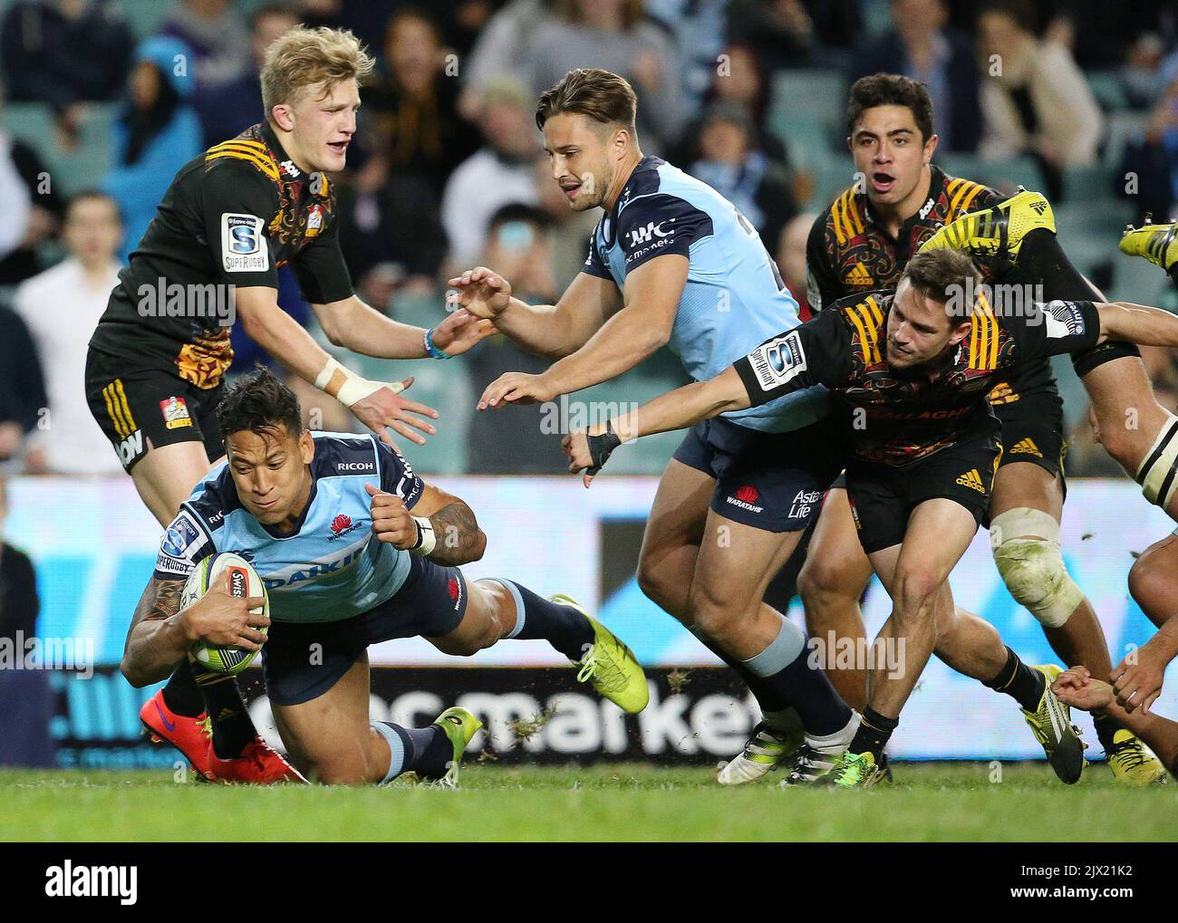 Israel Folau(left) of the Waratahs scores his second try during the ...