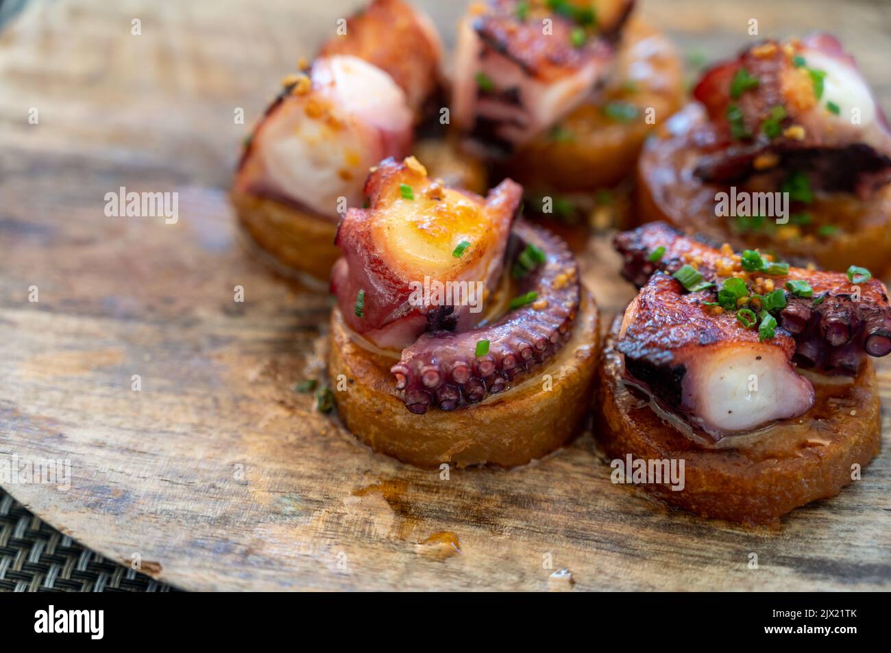 Spanish starter dish in fish restaurant in Getaria, grilled octopus ...