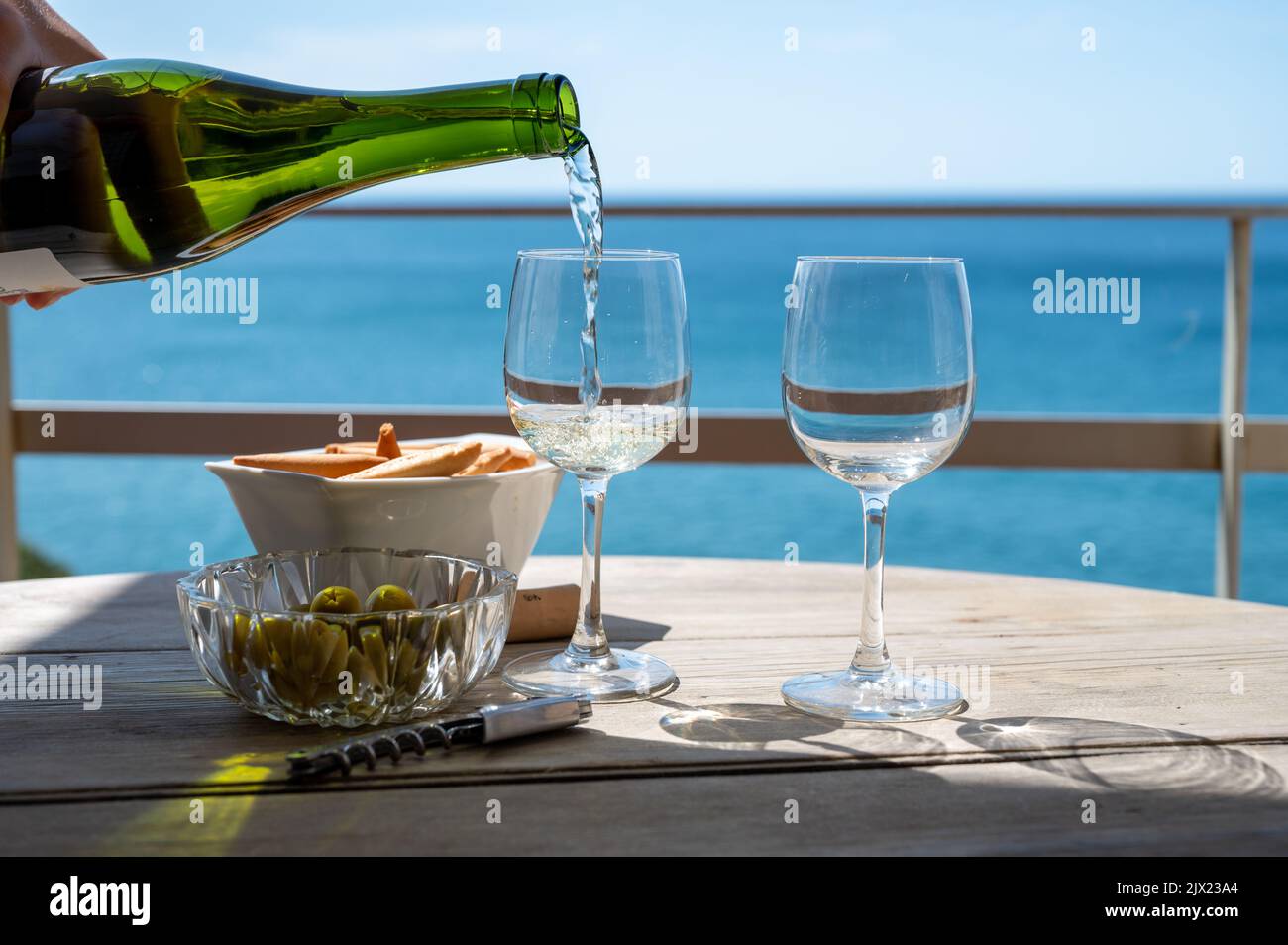 Pouring of txakoli or chacolí slightly sparkling very dry white wine ...