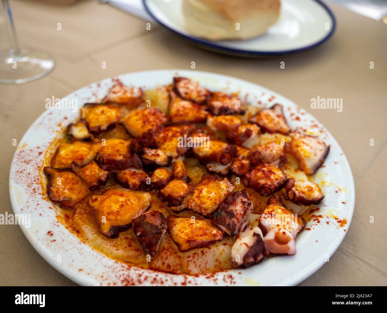 Tasty seafood, grilled octopus galician style with red pimento paprika ...