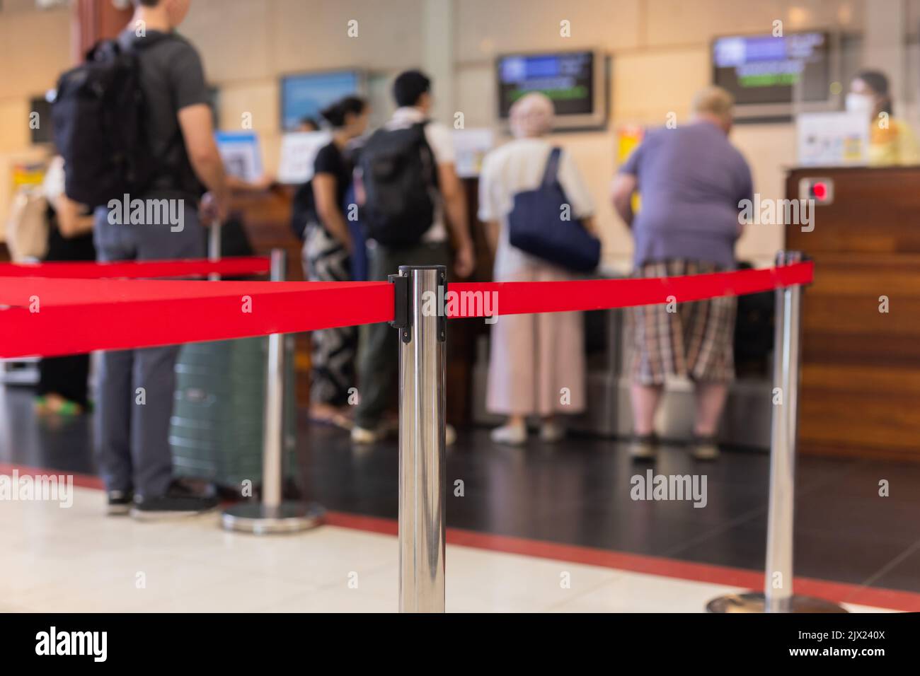 Selected focus on security post with passenger check in at the airport ...