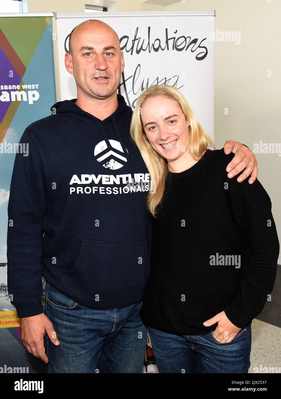 Alyssa Azar and her father Glenn, pose for a photo after arriving in ...