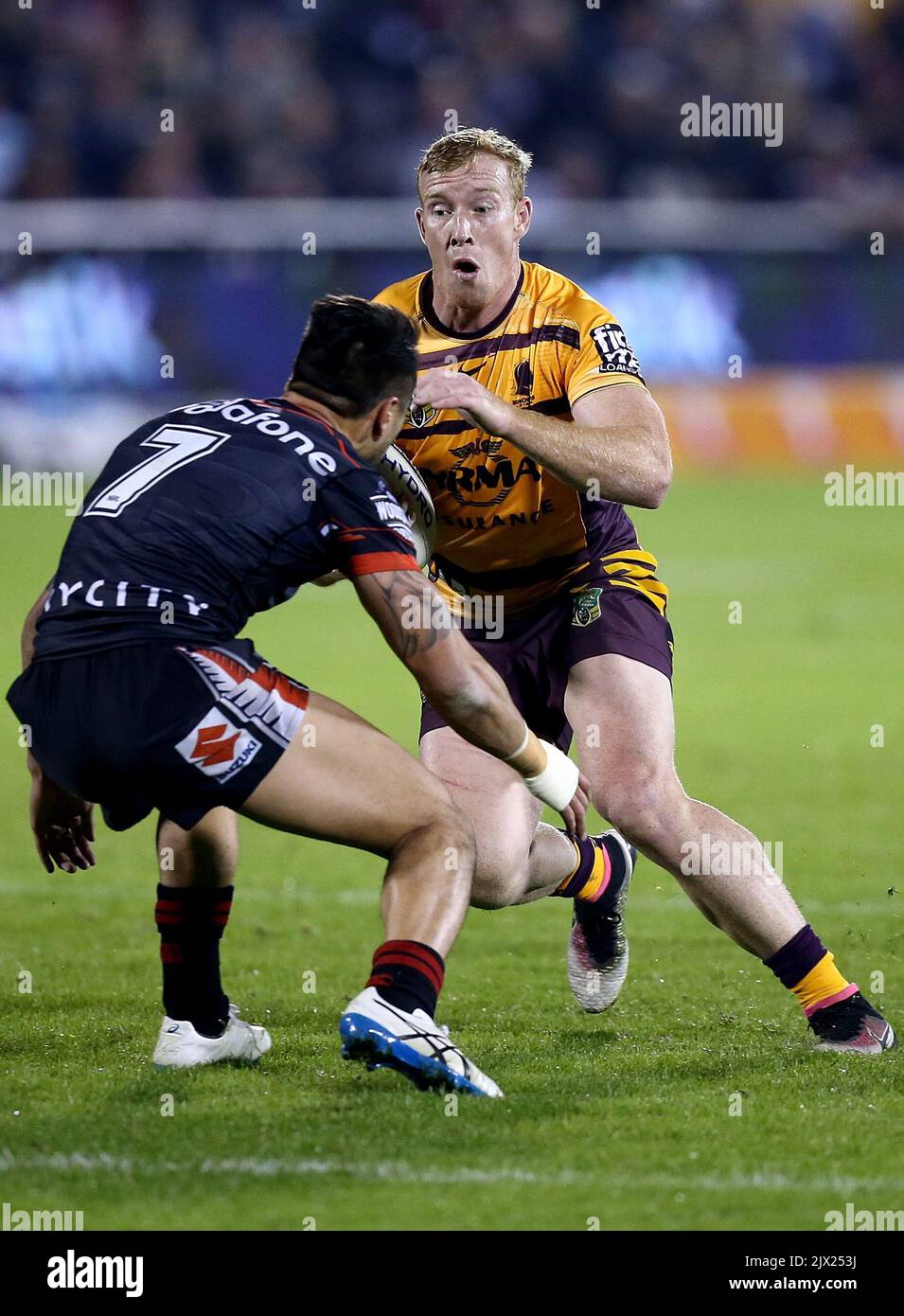 Jack Reed of the Broncos runs into defence from Shaun Johnson of the ...