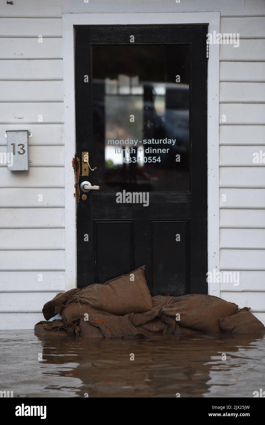 The Waterfront Seafood Restaurant is inundated by flood waters as high ...
