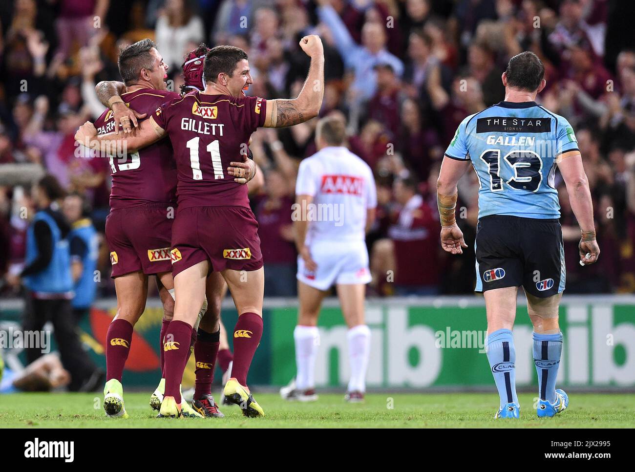 Queensland Maroons players celebrate winning Game 2 and the State of ...