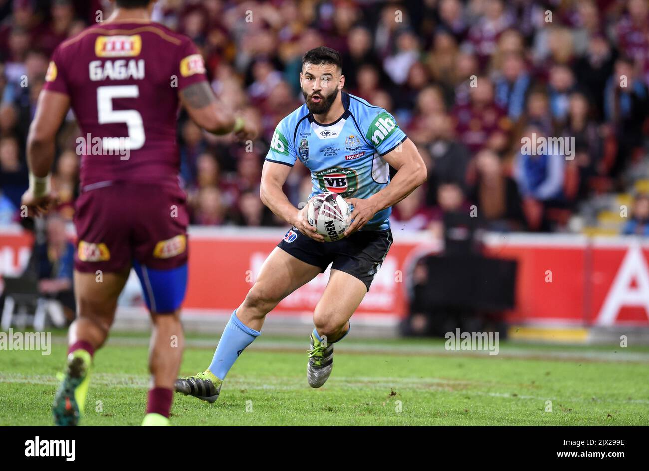 Josh Mansour of the NSW Blues (right) looks for a way around Dane Gagai ...