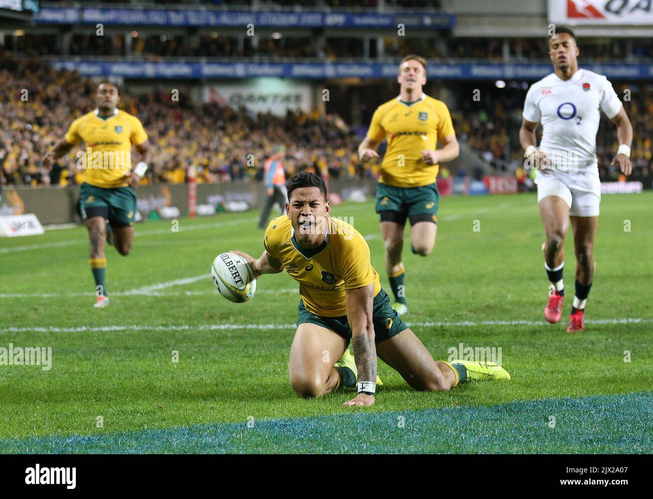 Australia's Israel Folou celebrates scoring a try against England ...