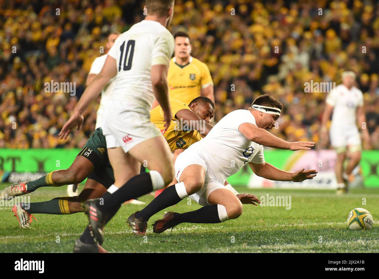 Jamie George of England dives on the ball to score during the 3rd test ...