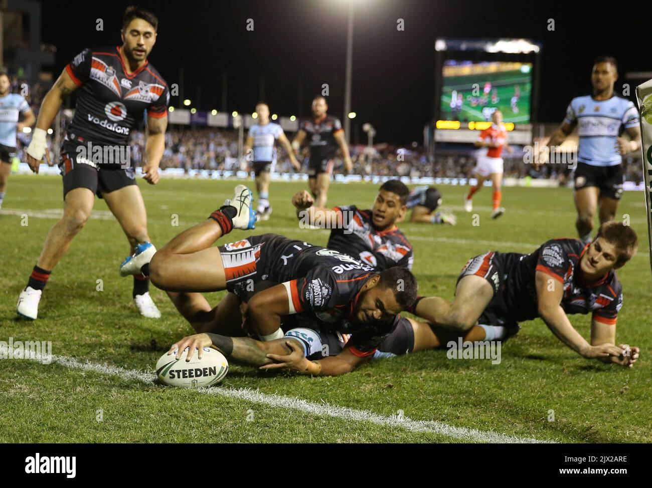Ricky Leutele of the Sharks scores during the round 16 NRL match ...