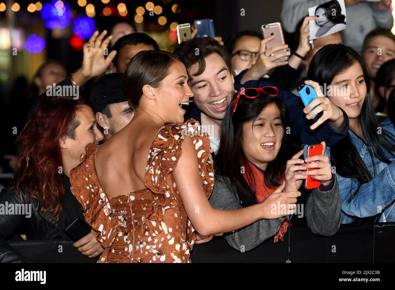 Swedish actor Alicia Vikander poses for a photograph with fans as she ...