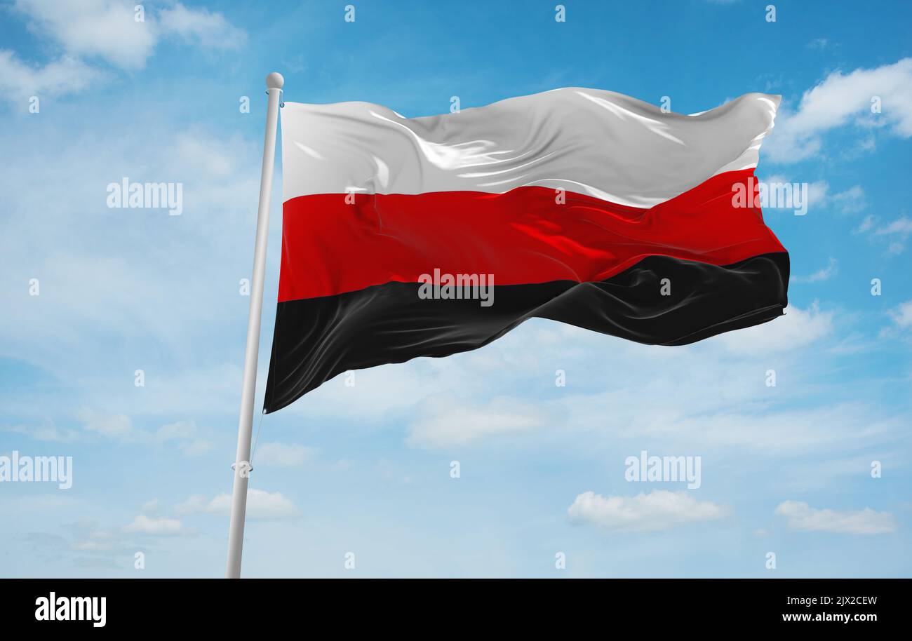 flag of Austronesian peoples Batak people at cloudy sky background ...