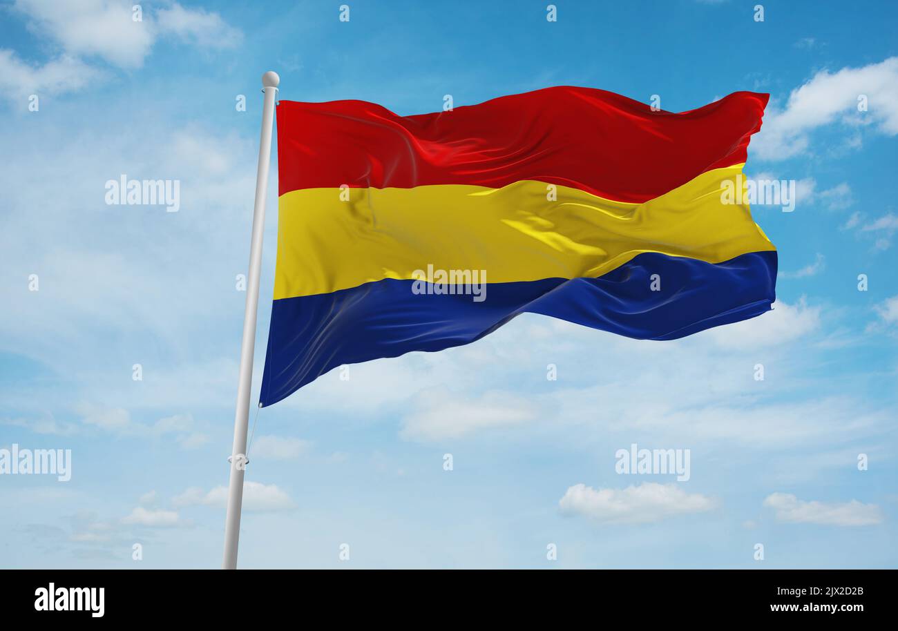 flag of Austronesian peoples Dayaks at cloudy sky background, panoramic ...