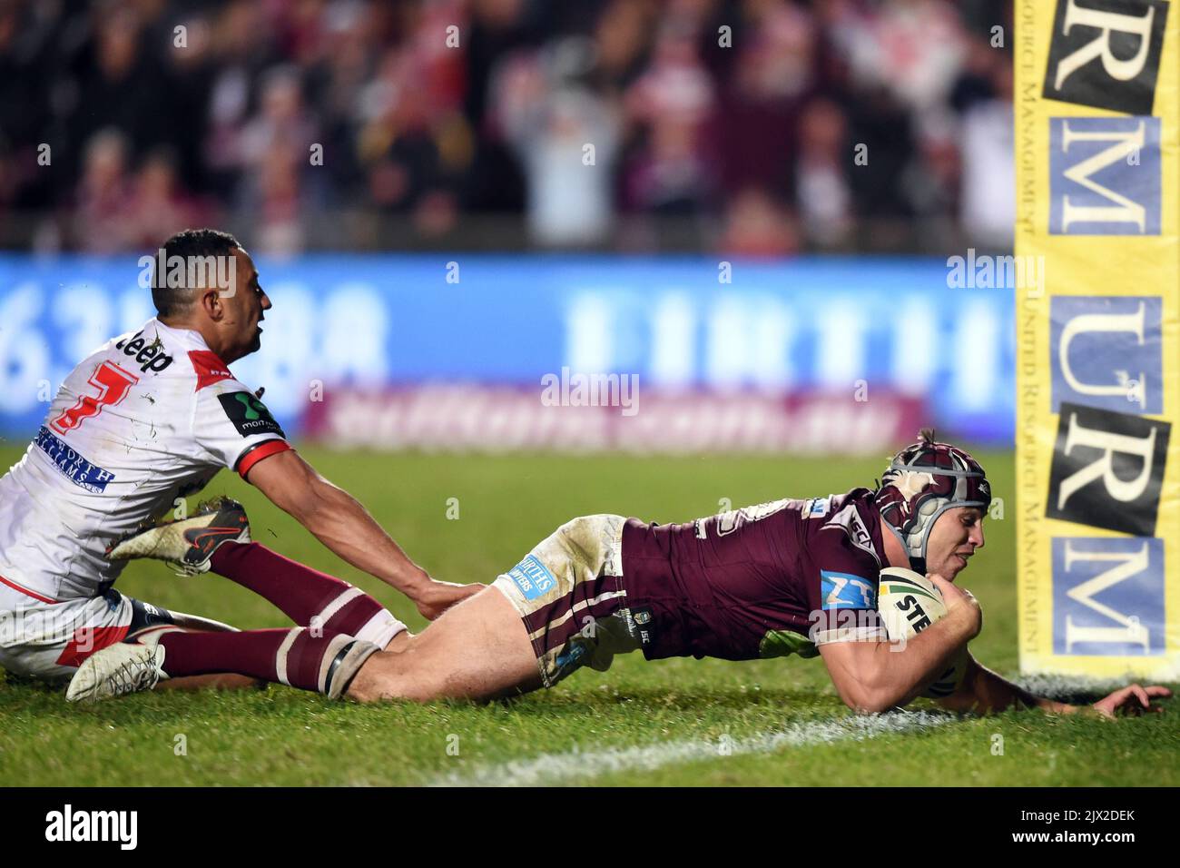 Jamie Buhrer (right) of the Sea Eagles scores a try during the round 17 ...