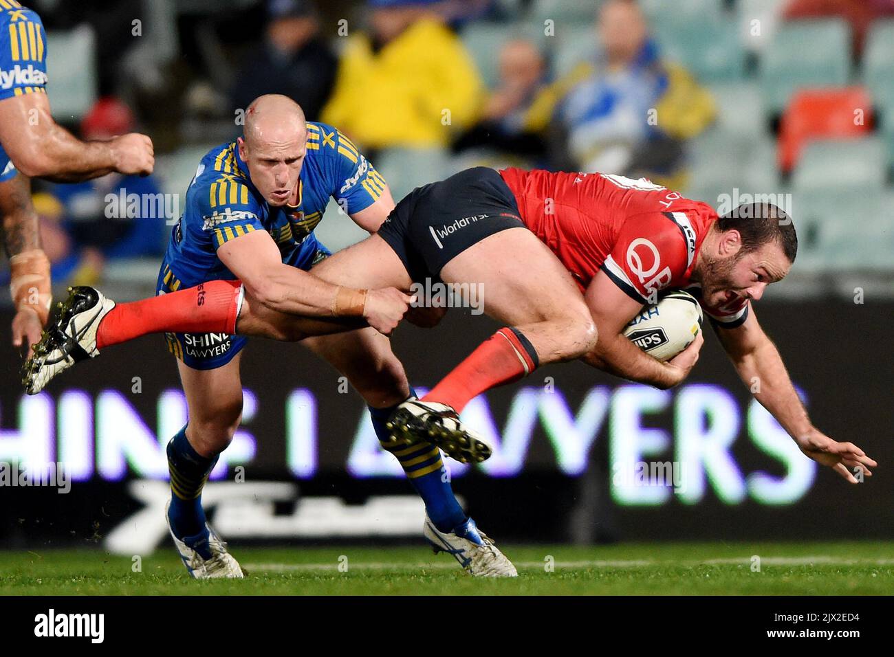 Jeff Robson of the Eels tackles Boyd Cordner of the Roosters during ...