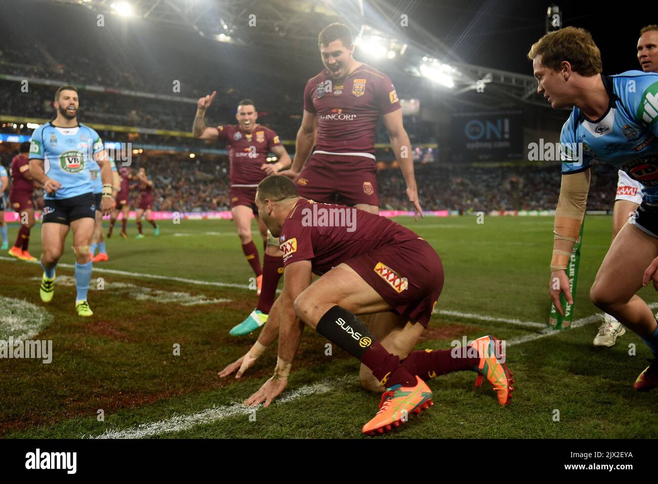 Maroons players celebrate Greg Inglis' (centre) try during State of ...