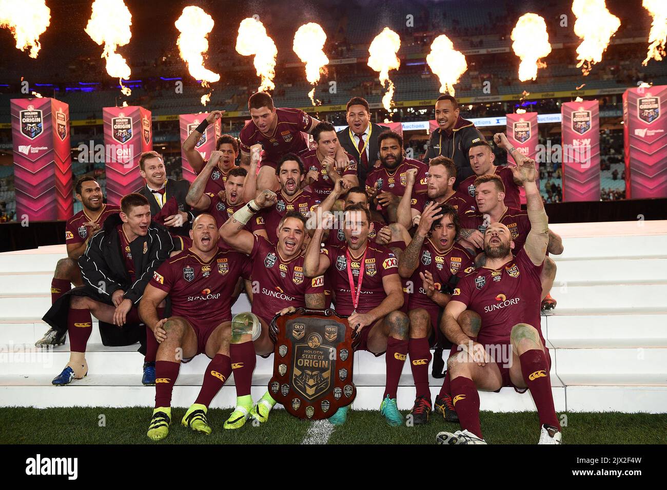 The Maroons pose for a photograph with the State of Origin shield after ...