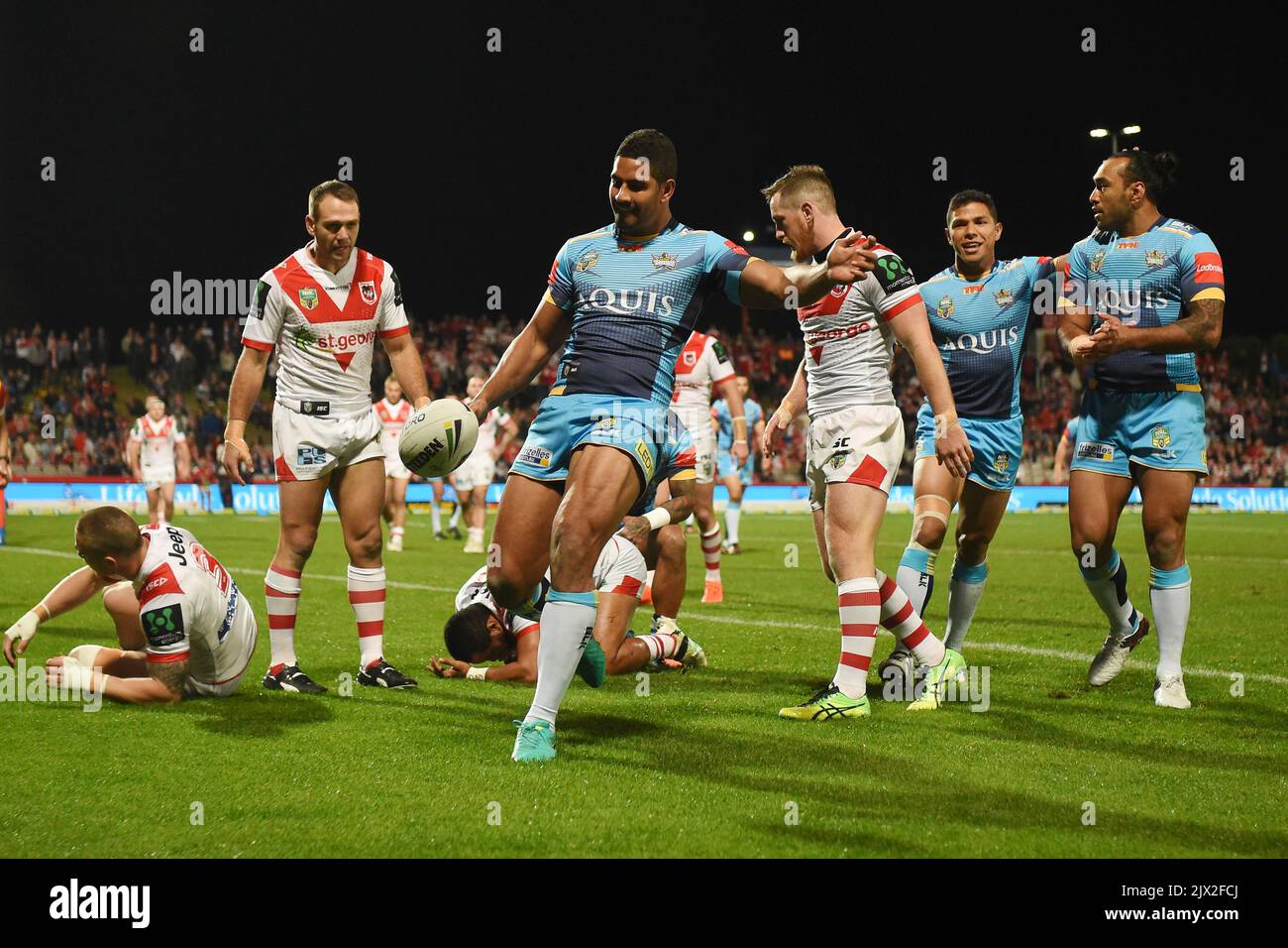 Nene MacDonald of the Titans celebrates after scoring a try during ...