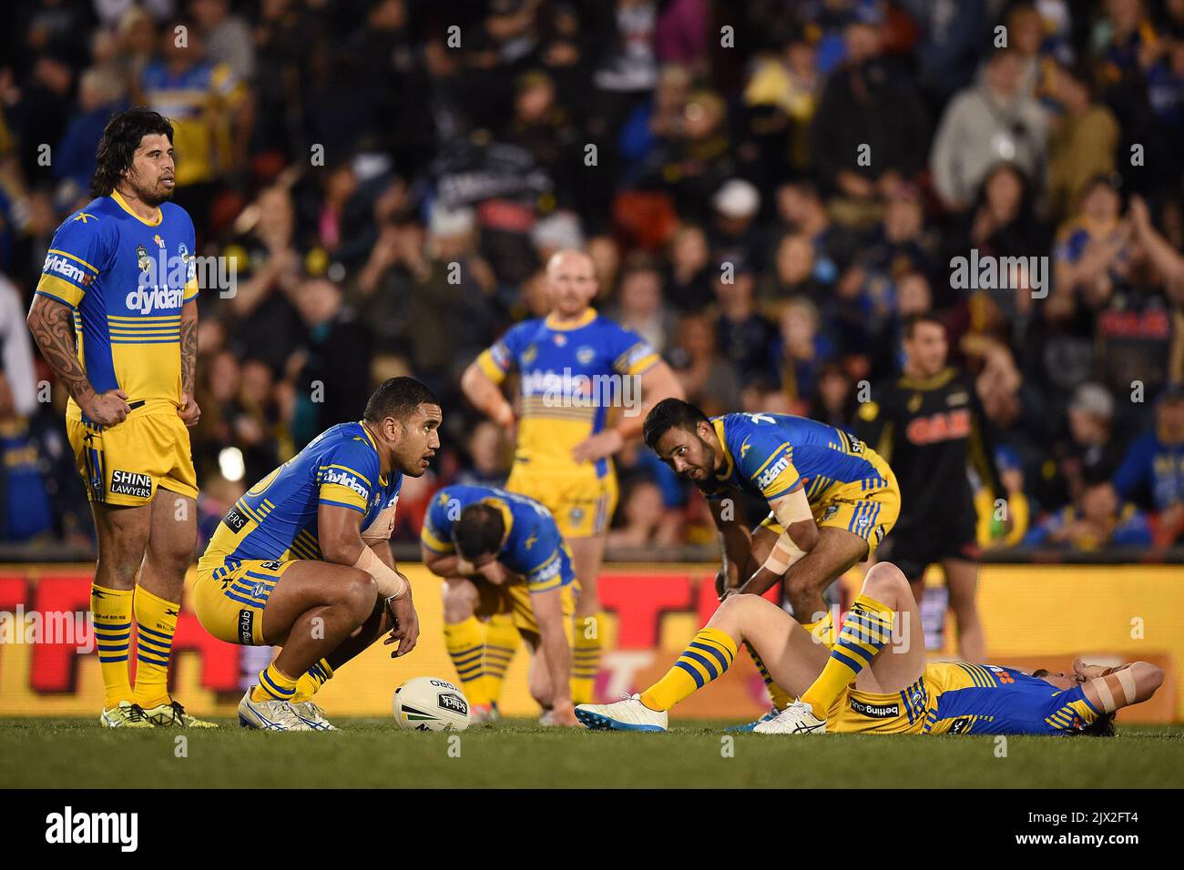 Eels players react following their loss to the Panthers in the round 19 NRL match between the ...