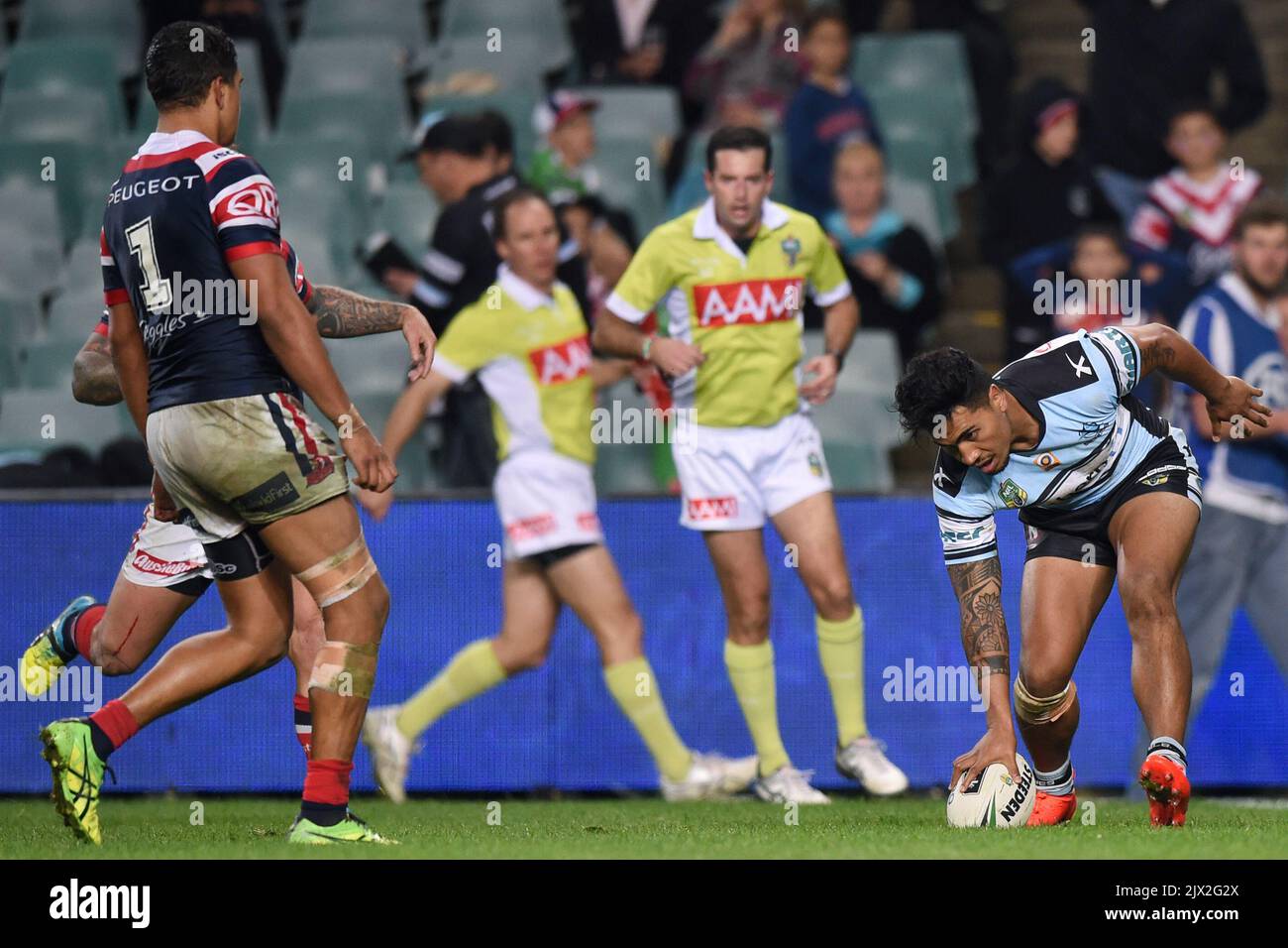 Sosaia Feki (right) of the Sharks scores a try during the round 19 NRL ...