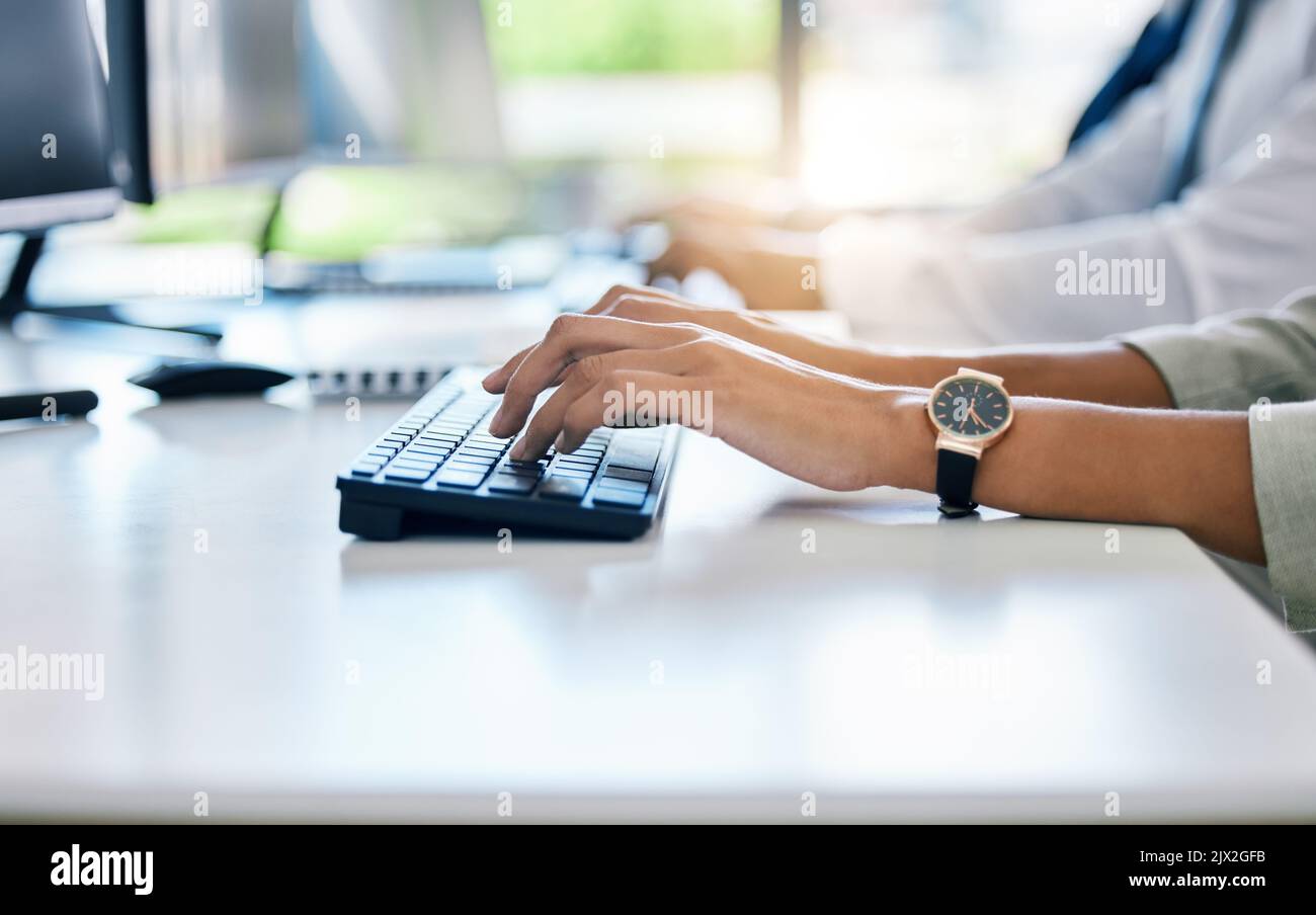 Hands, keyboard and typing with a business woman working on a computer ...