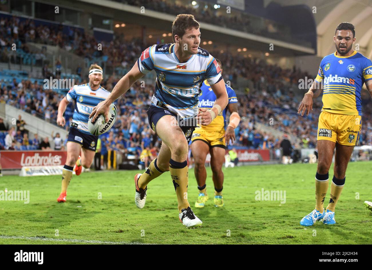 Titans player Anthony Don crosses over to score a try during the Round ...