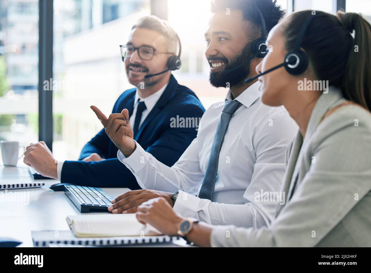 Teamwork, diversity and collaboration, a team of call centre employees ...