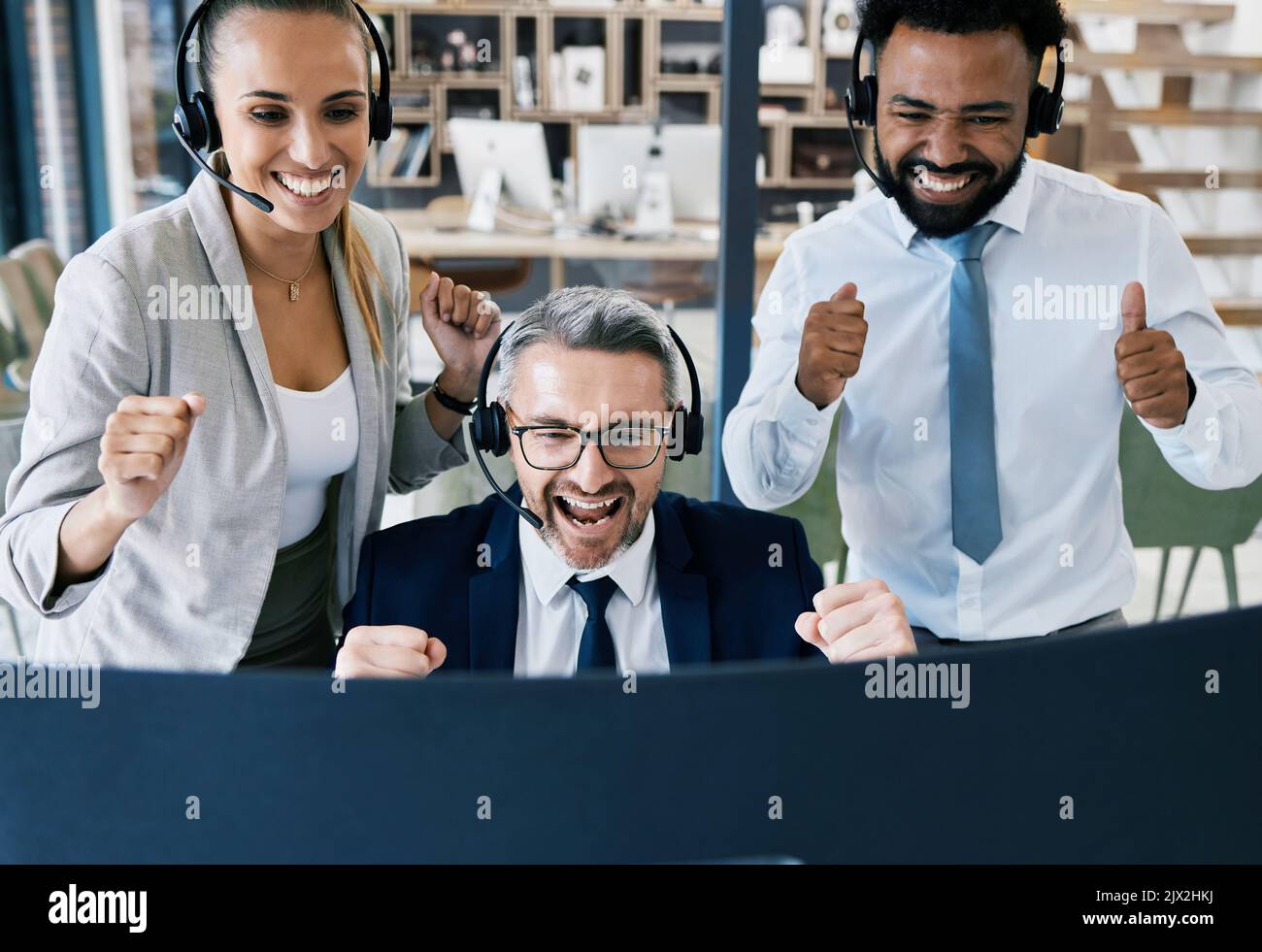 Call center, customer support and celebration with a team of service ...