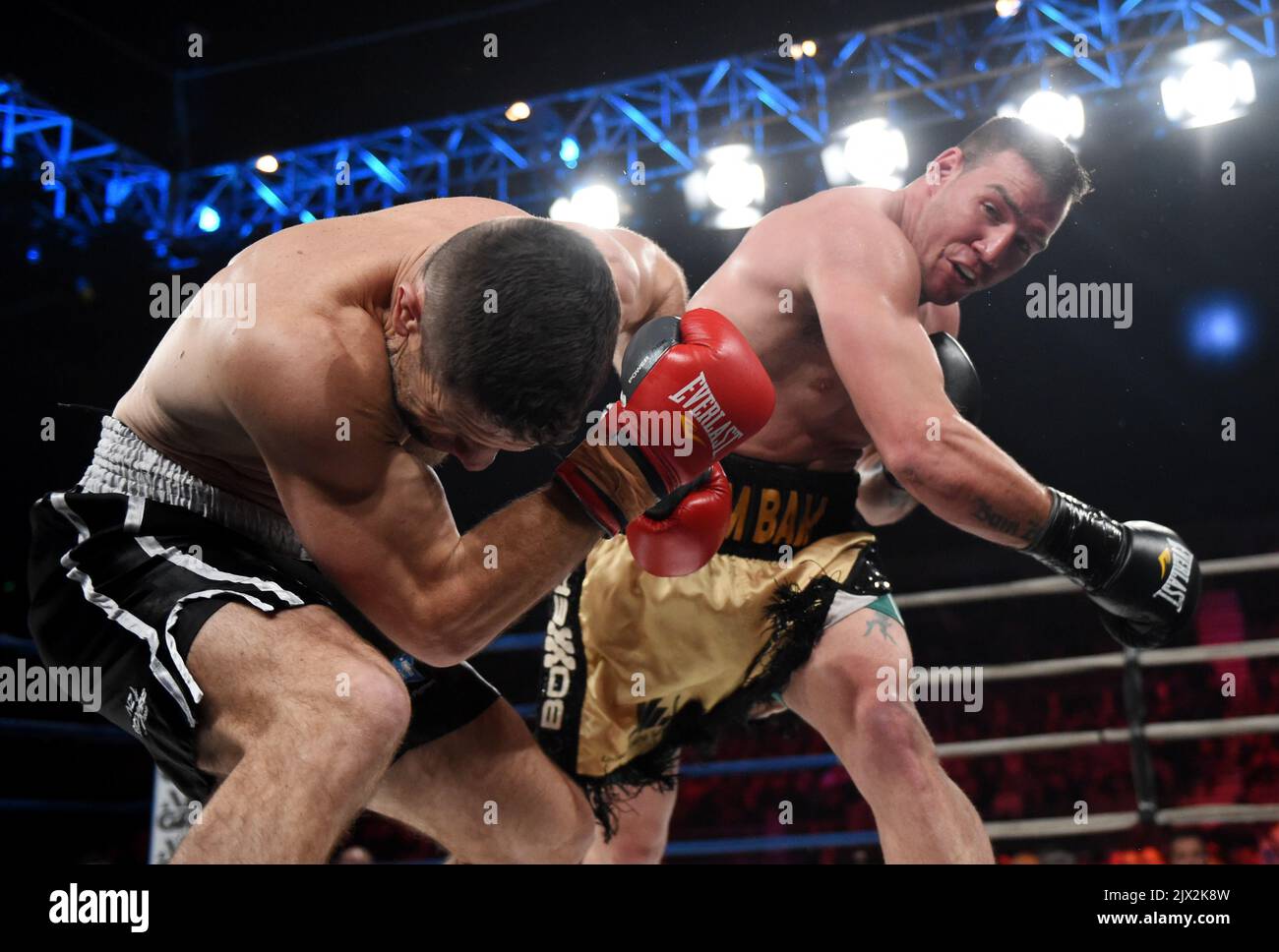 James Langdon fights Mark Flanagan (right) in their bout before the ...