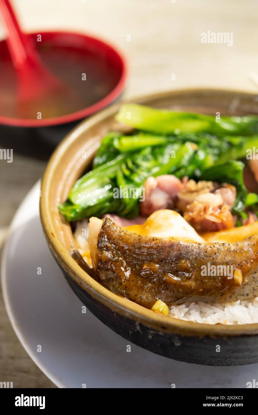 angle view clay pot rice with cured pork and fish and vegetable Stock ...