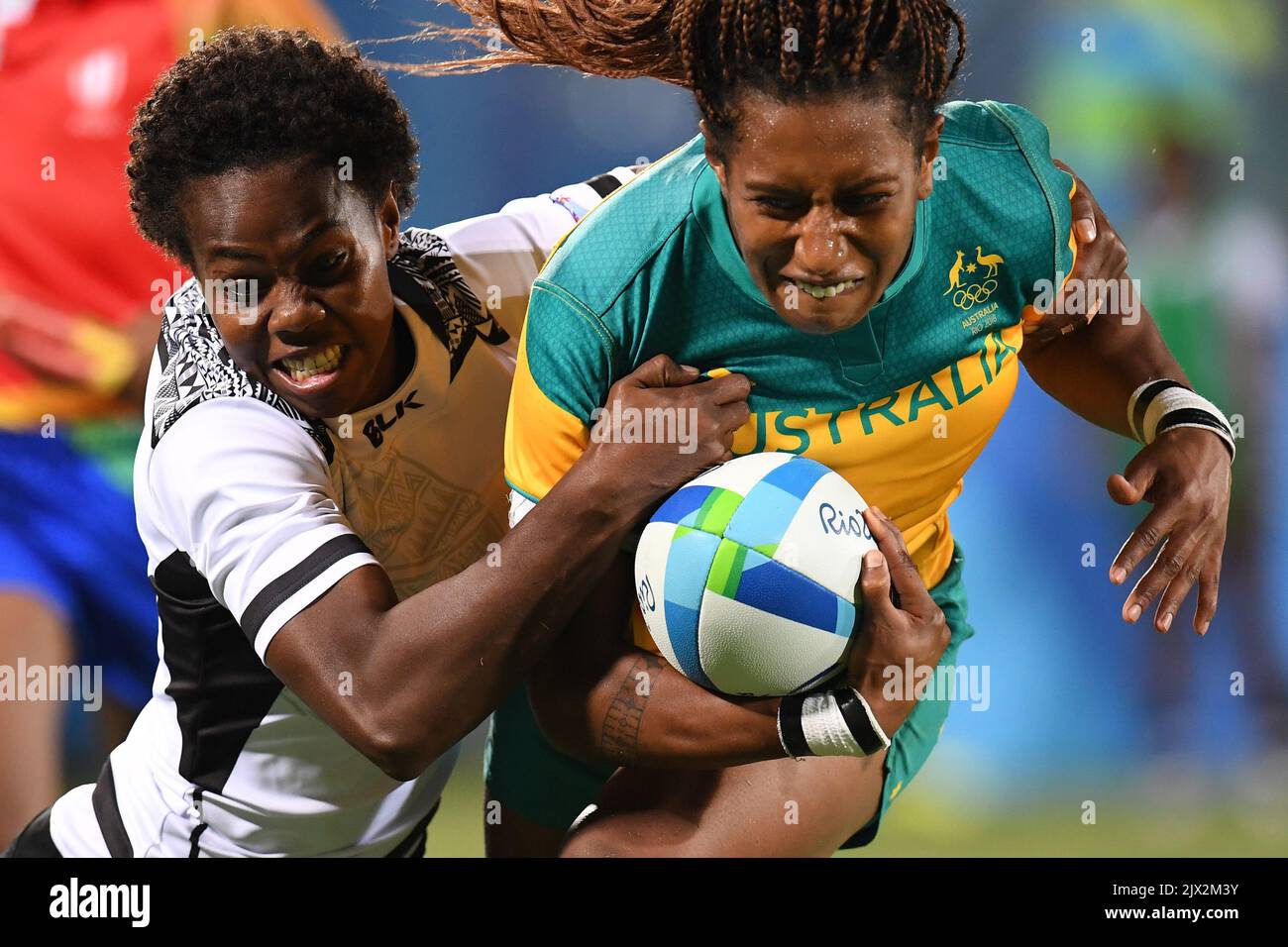 Australia's Ellia Green scores despite the efforts of Fiji's Raijieli ...