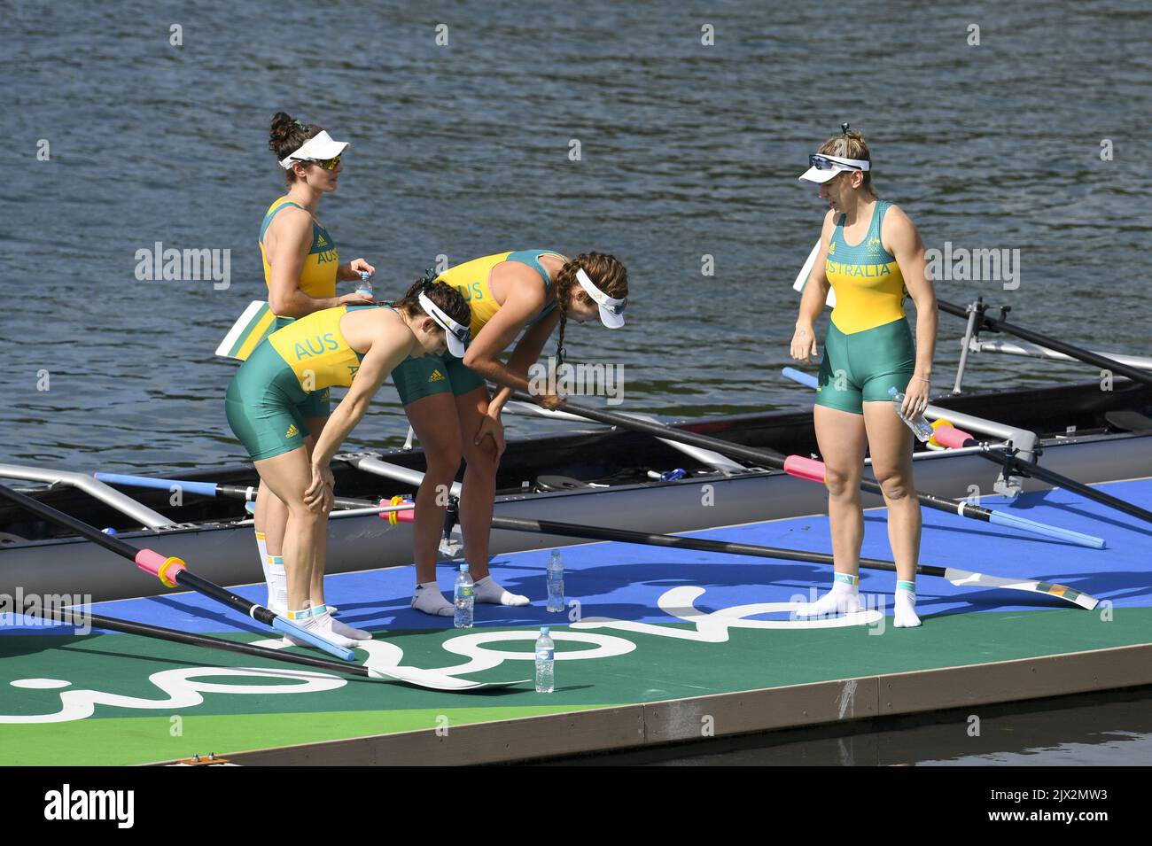 Members of the Australian team react after competing in the Women's ...