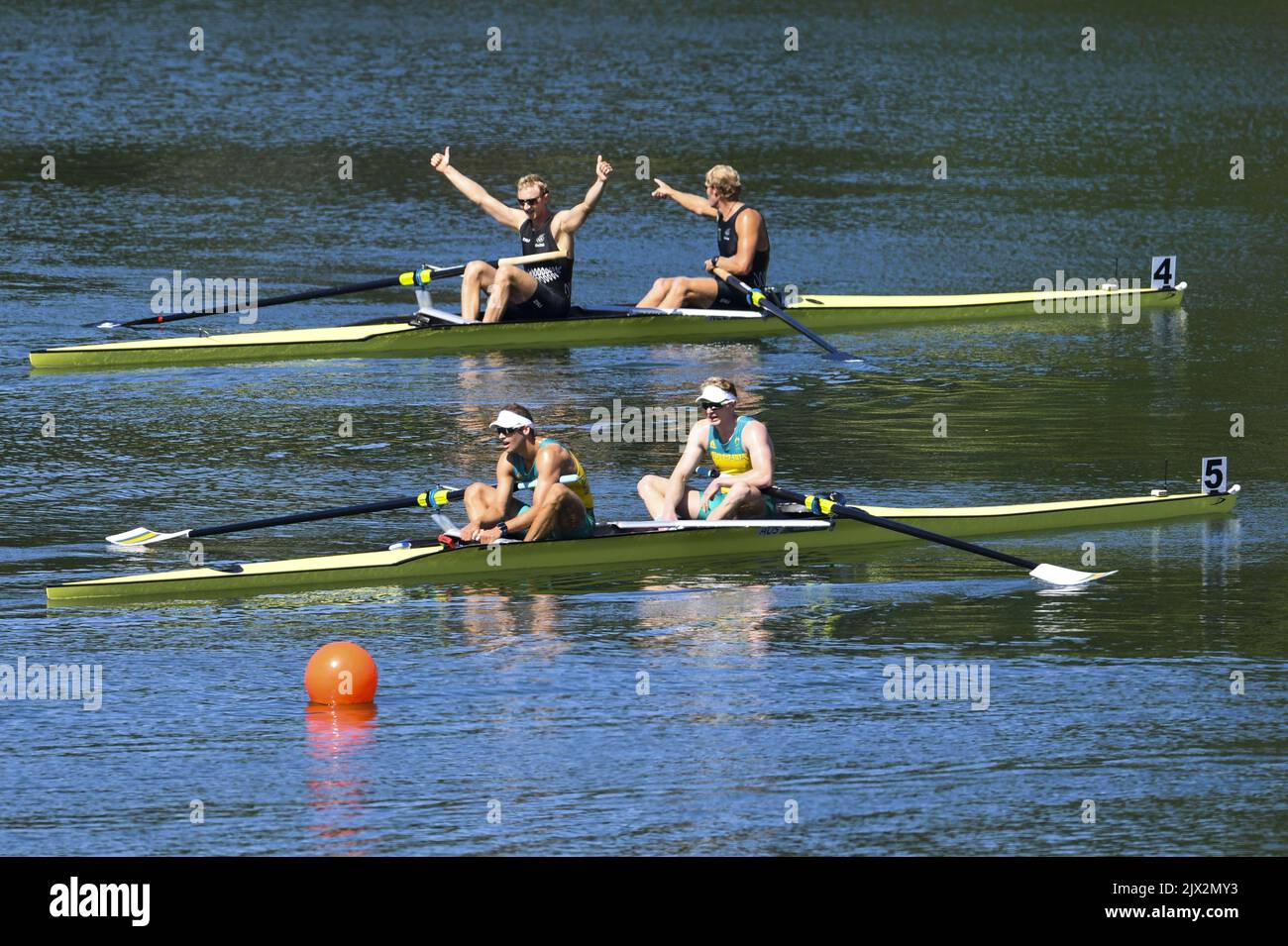 Eric Murray and Hamish Bond of New Zealand celebrate winning Gold as ...