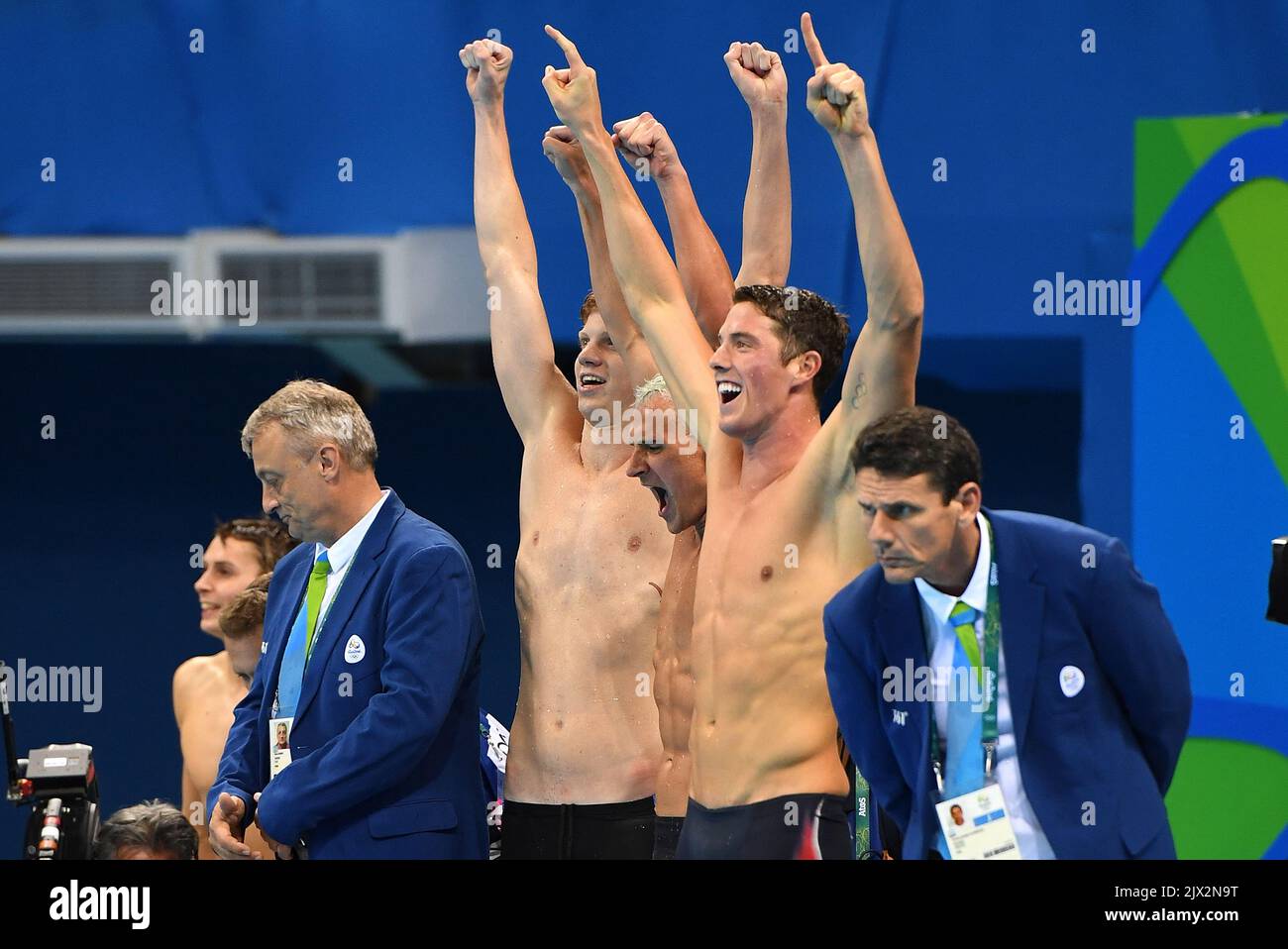 Members of the United States relay team celebrate winning gold in the ...