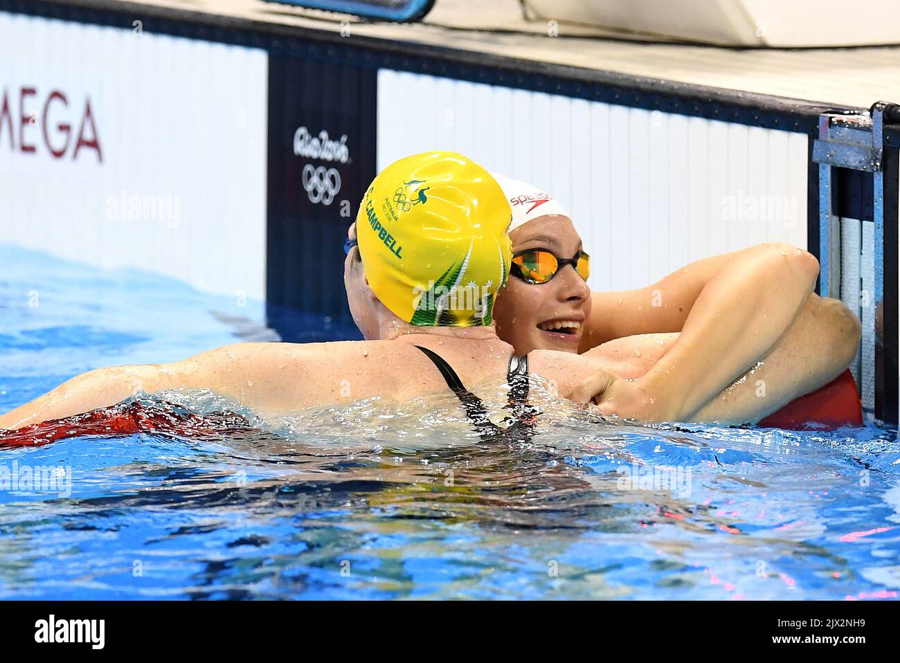 Cate Campbell of Australia (facing away) is congratulated by Penny ...